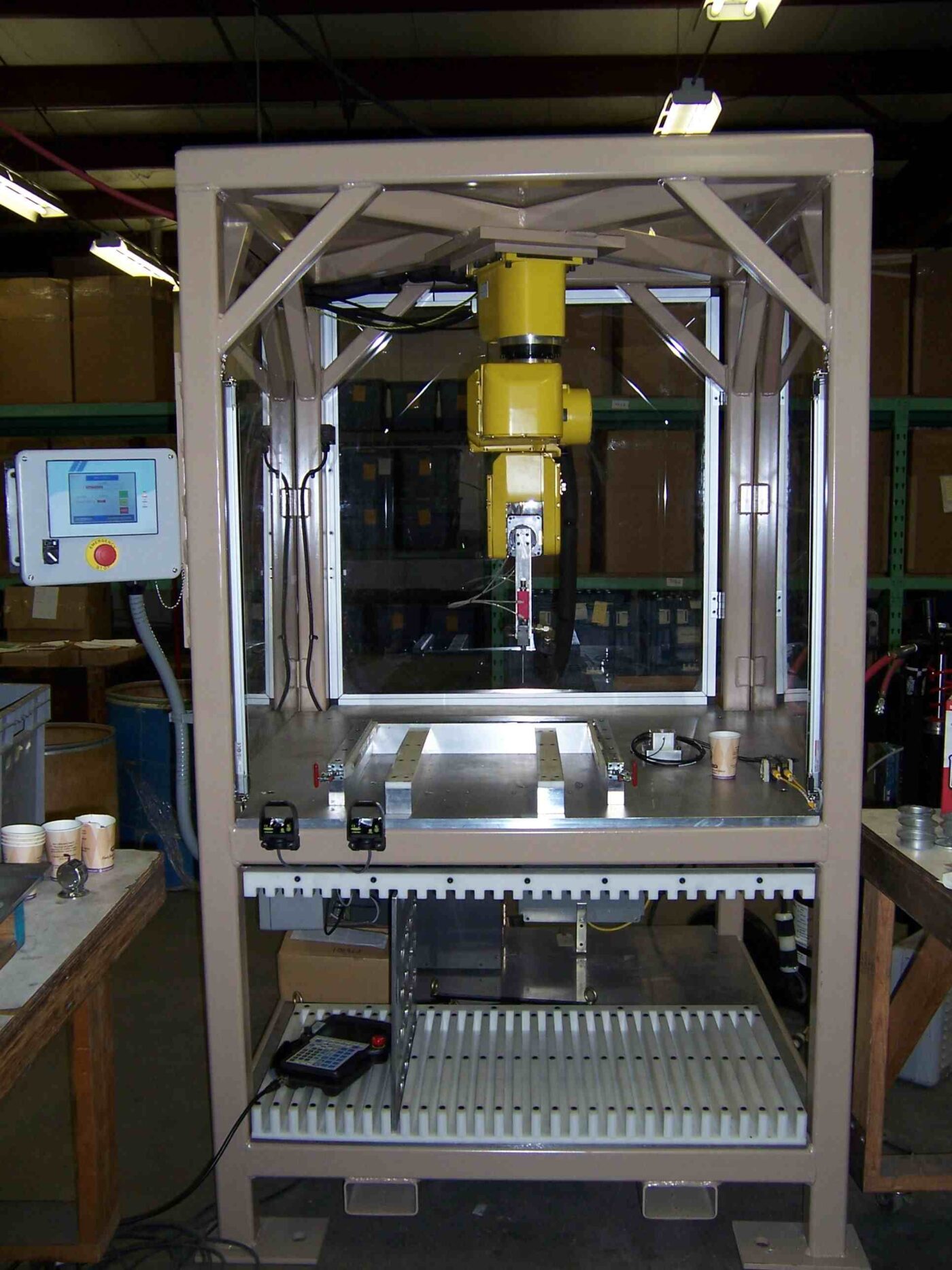 Custom Designed Robotic Cell for Adhesive Application within the ...